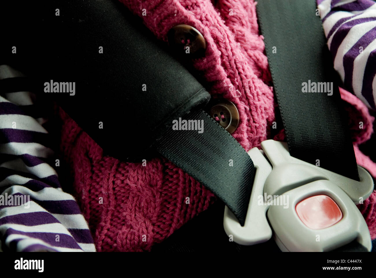 Child strapped into car safety seat Stock Photo - Alamy