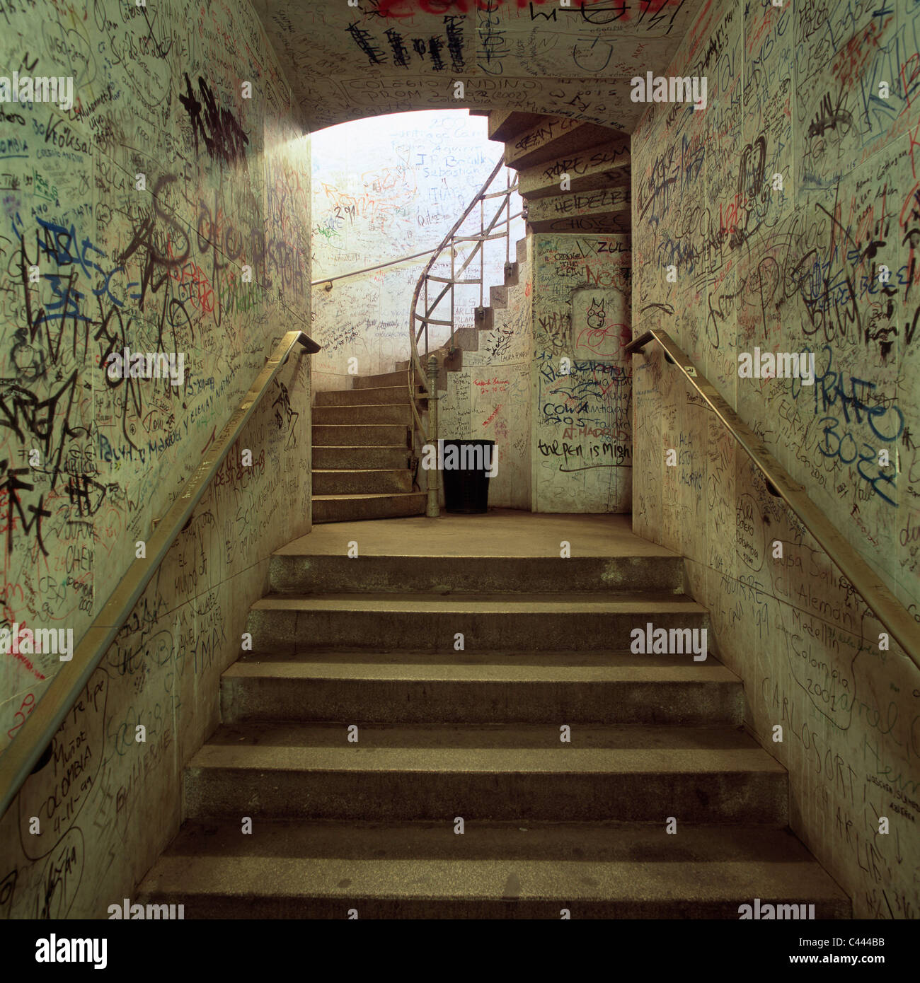An underground stairway with graffiti on the walls Stock Photo - Alamy