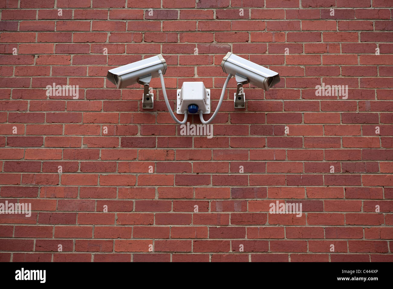 Video surveillance cameras on a wall Stock Photo - Alamy