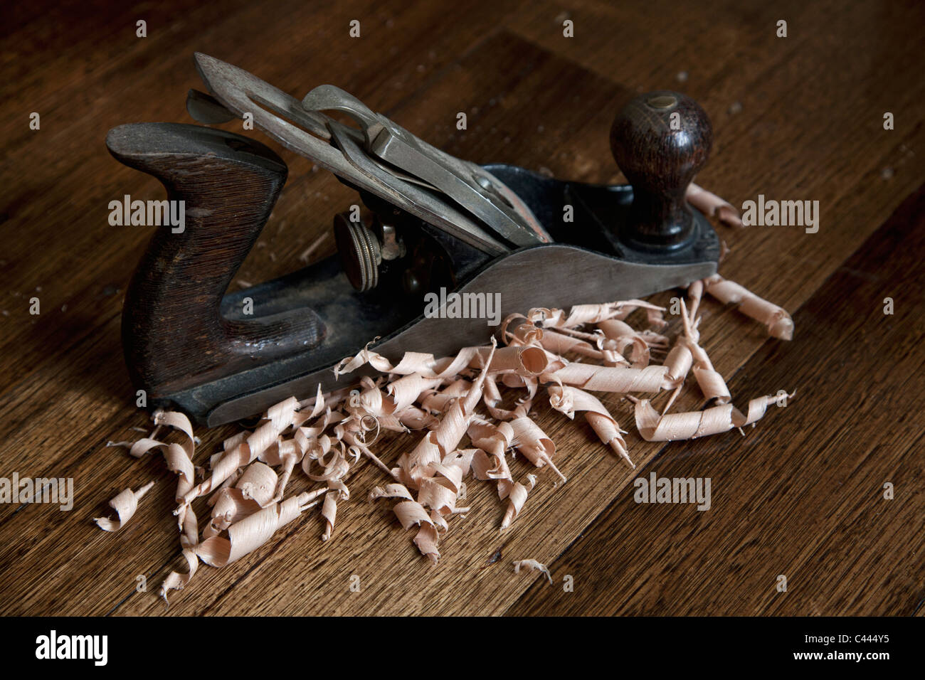 A wood planing tool and shavings Stock Photo - Alamy
