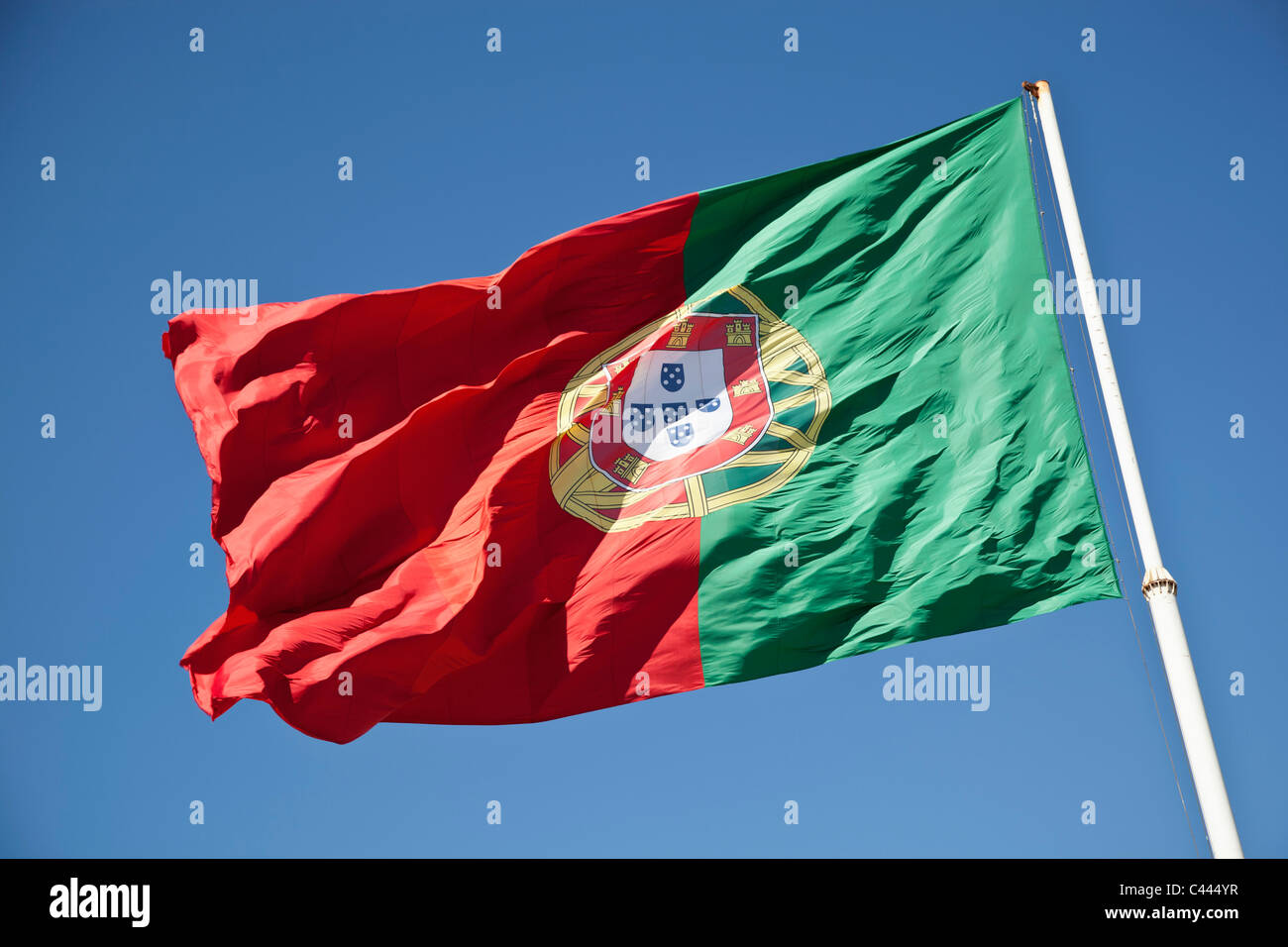 Portuguese flag flying Stock Photo - Alamy