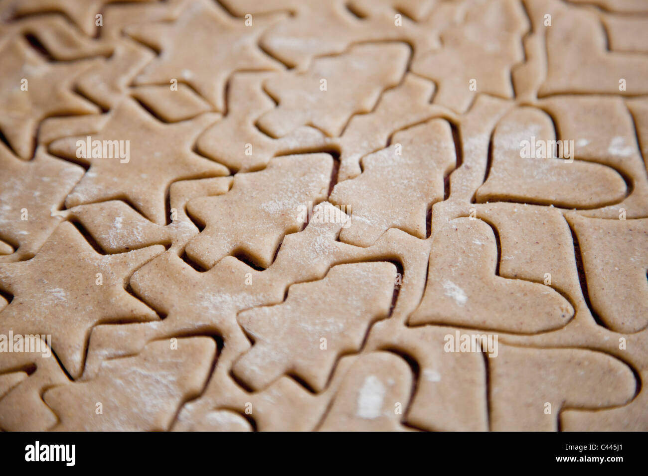 Various shaped cookies in dough Stock Photo - Alamy