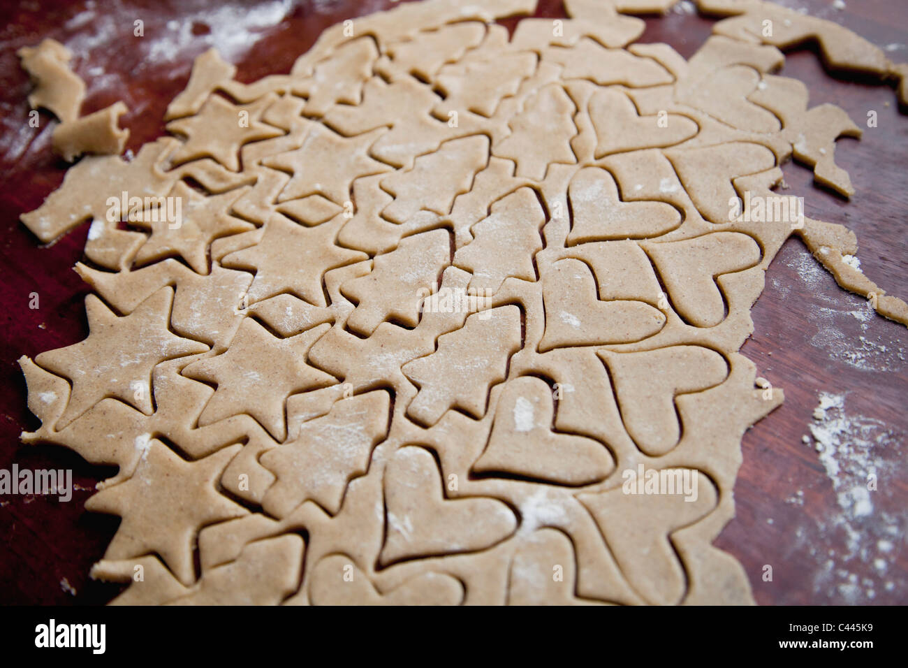 Various shaped cookies in dough Stock Photo - Alamy