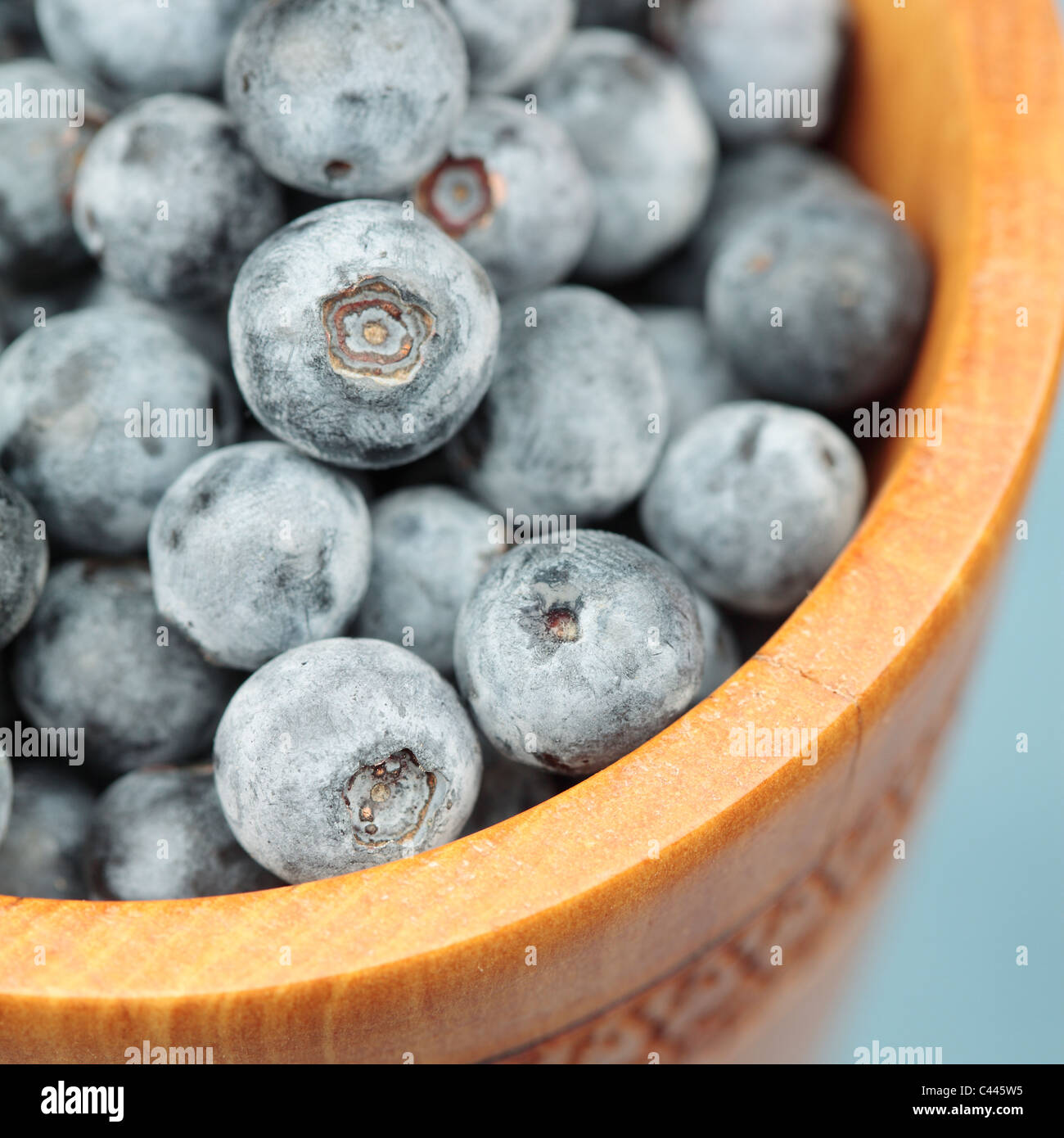 Blueberries in Wooden Bowl Stock Photo - Alamy