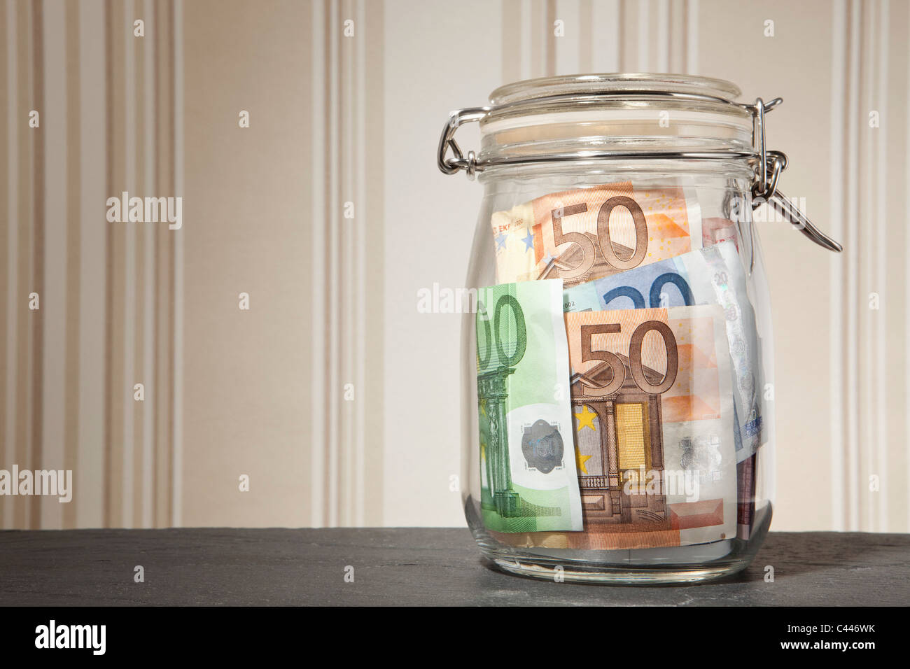 Glass jar full of money hi-res stock photography and images - Alamy