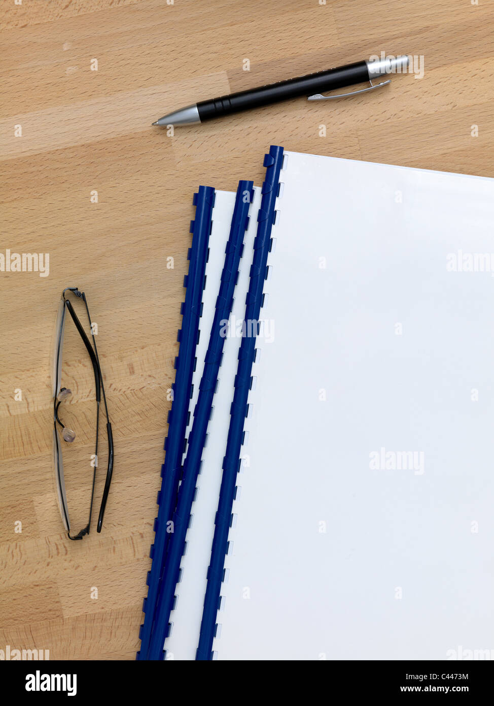 An office desk with office items in a work place scene Stock Photo - Alamy