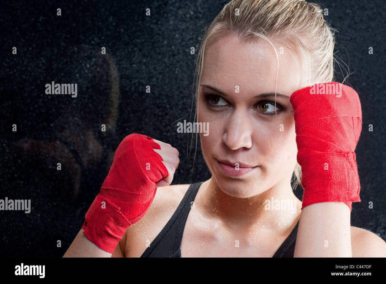 Boxing training blond woman sparring and sweating Stock Photo - Alamy