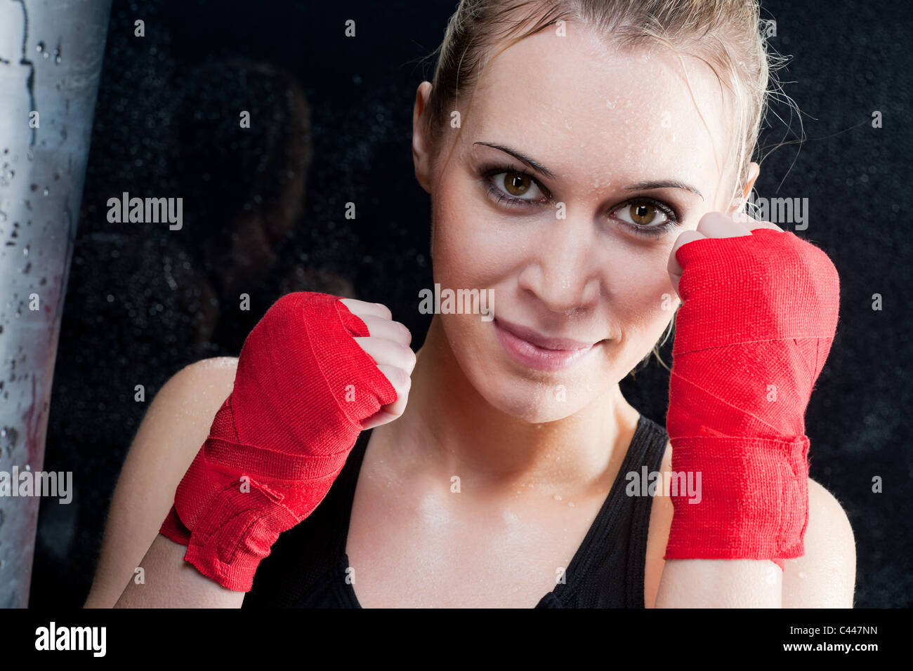 Boxing training blond woman sparring and sweating Stock Photo - Alamy