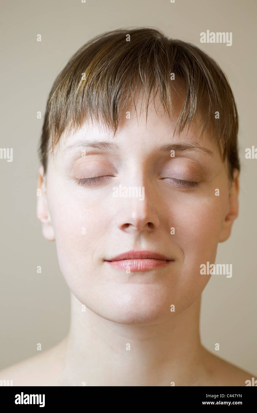 A woman with her eyes closed, close-up Stock Photo - Alamy
