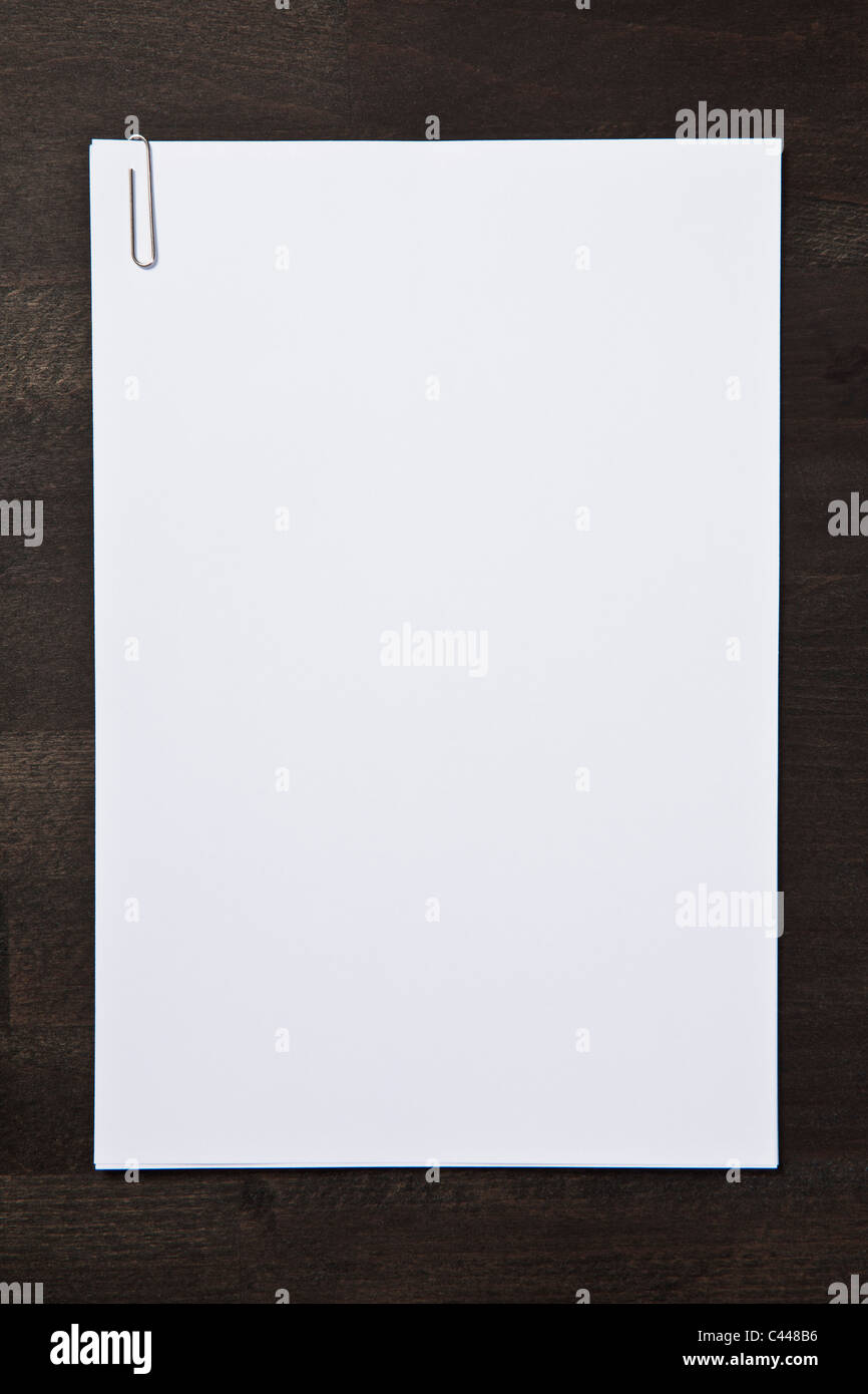Paper clipped blank paper Stock Photo - Alamy