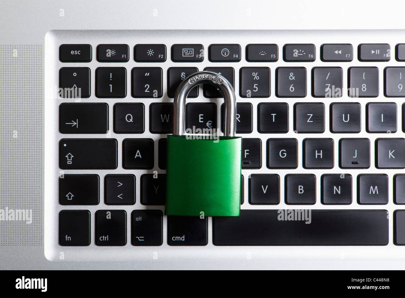 A padlock on top of a laptop keyboard Stock Photo - Alamy