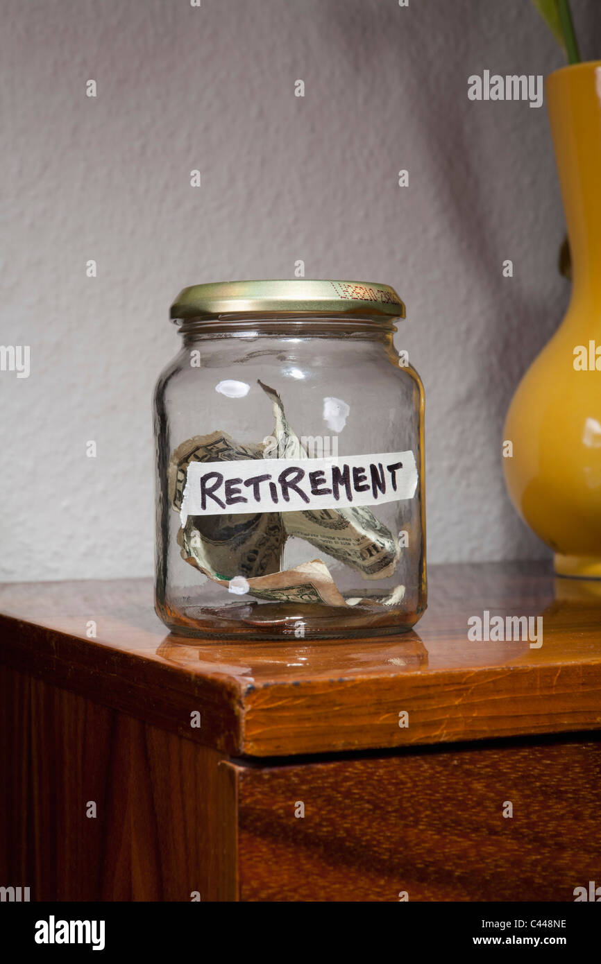 Money in a jar labeled RETIREMENT Stock Photo - Alamy