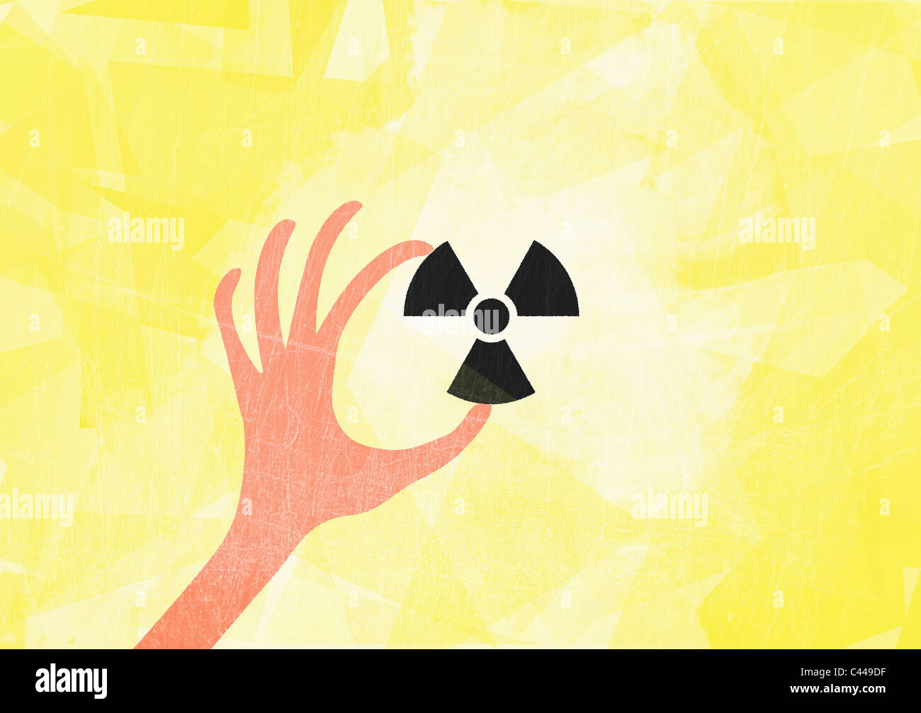 A hand holding a radioactive symbol Stock Photo - Alamy