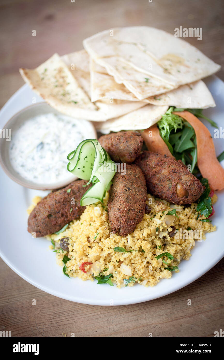 A mezze of Falafel, cous cous, tzaziki and leavened bread Stock Photo ...