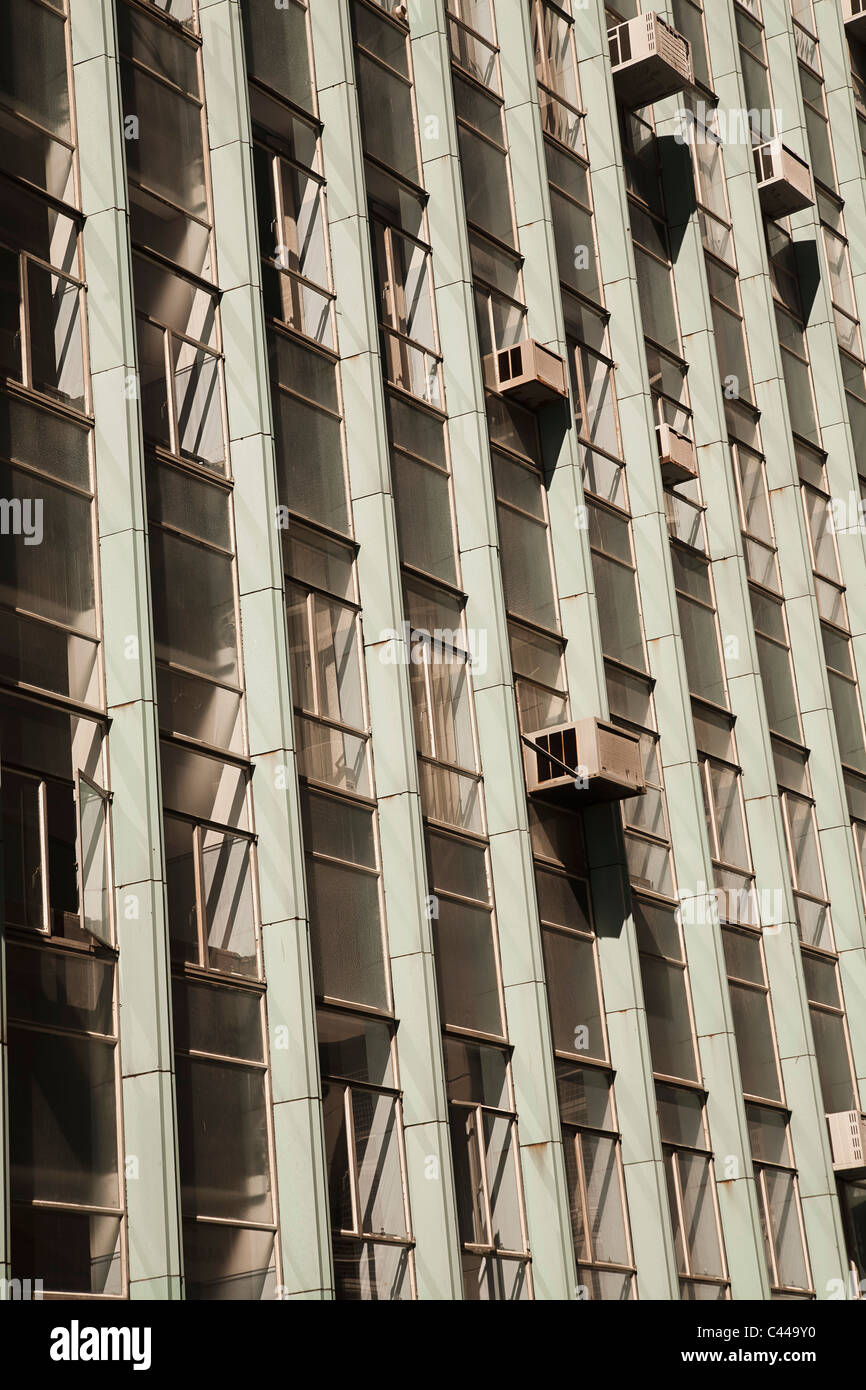 Tower block showing windows and air conditioners Stock Photo - Alamy