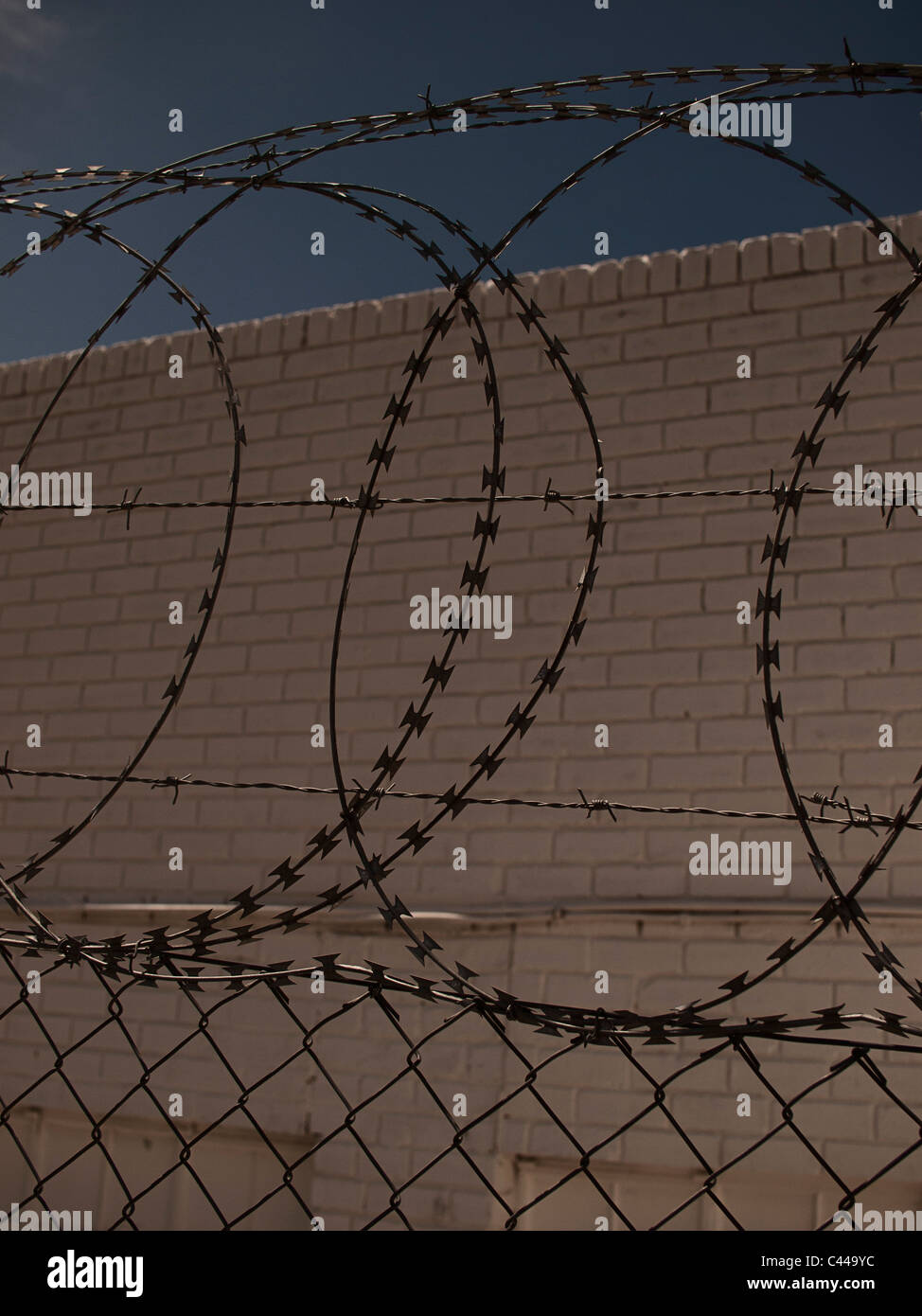 Wall with barb wire hi-res stock photography and images - Alamy