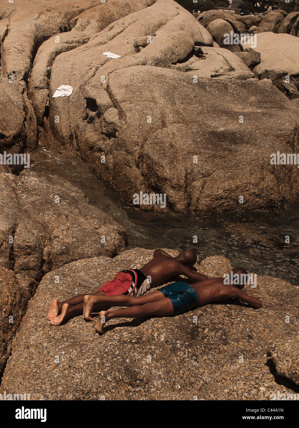 Men lying down sunbathing hi-res stock photography and images - Alamy