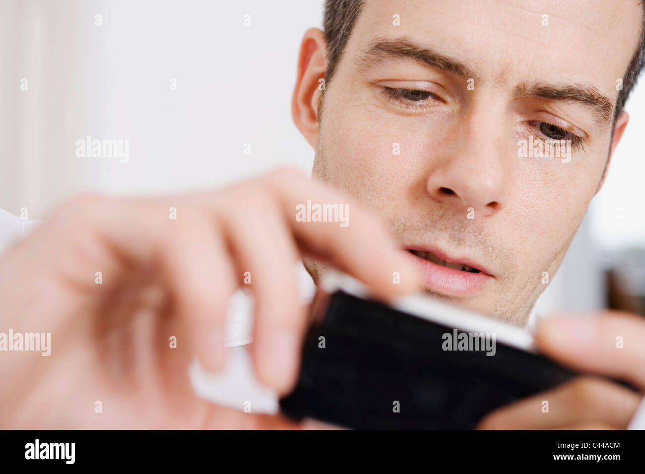 A man using a smart phone Stock Photo - Alamy
