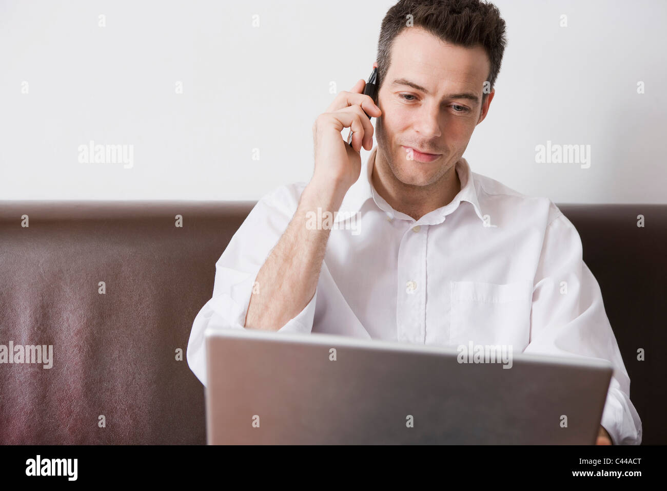 Man multitasking office hi-res stock photography and images - Alamy