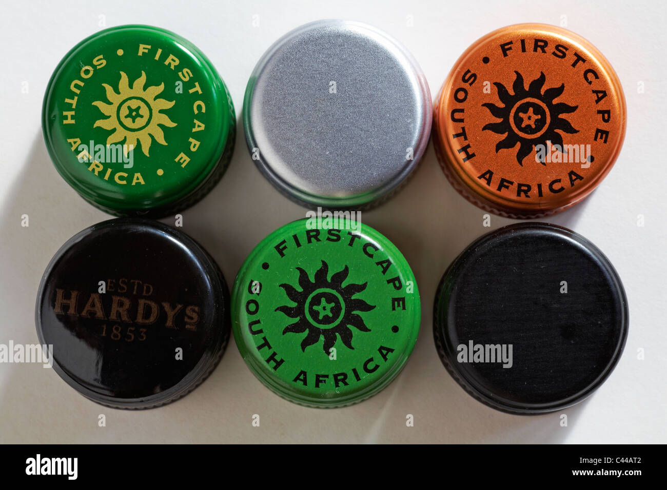 Selection of screw caps off of wine bottles isolated on white ...