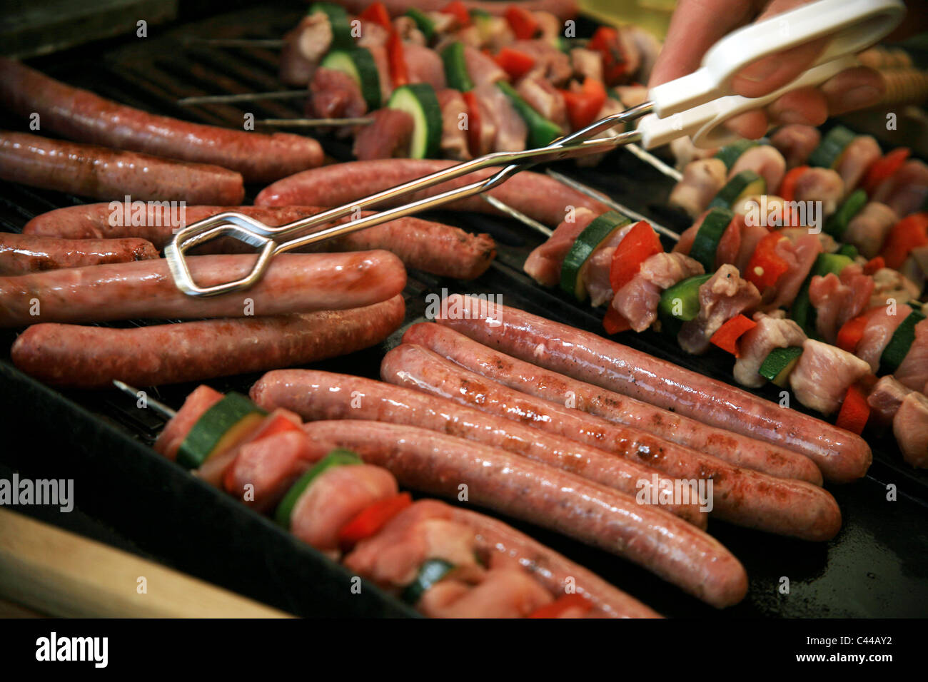 Man cooking on BBQ Stock Photo - Alamy
