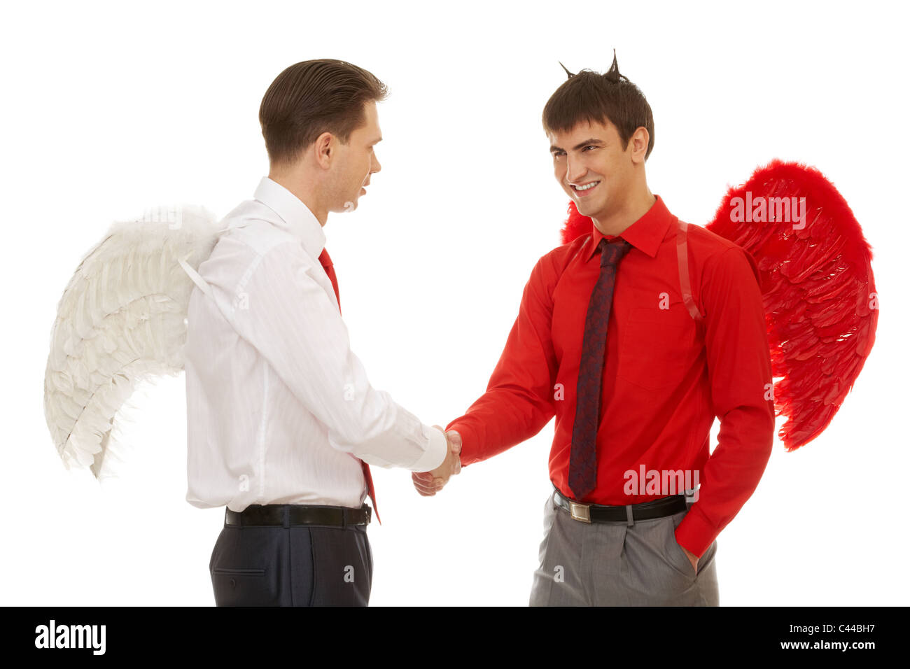 Handshake of god and devil isolated on white background Stock Photo - Alamy