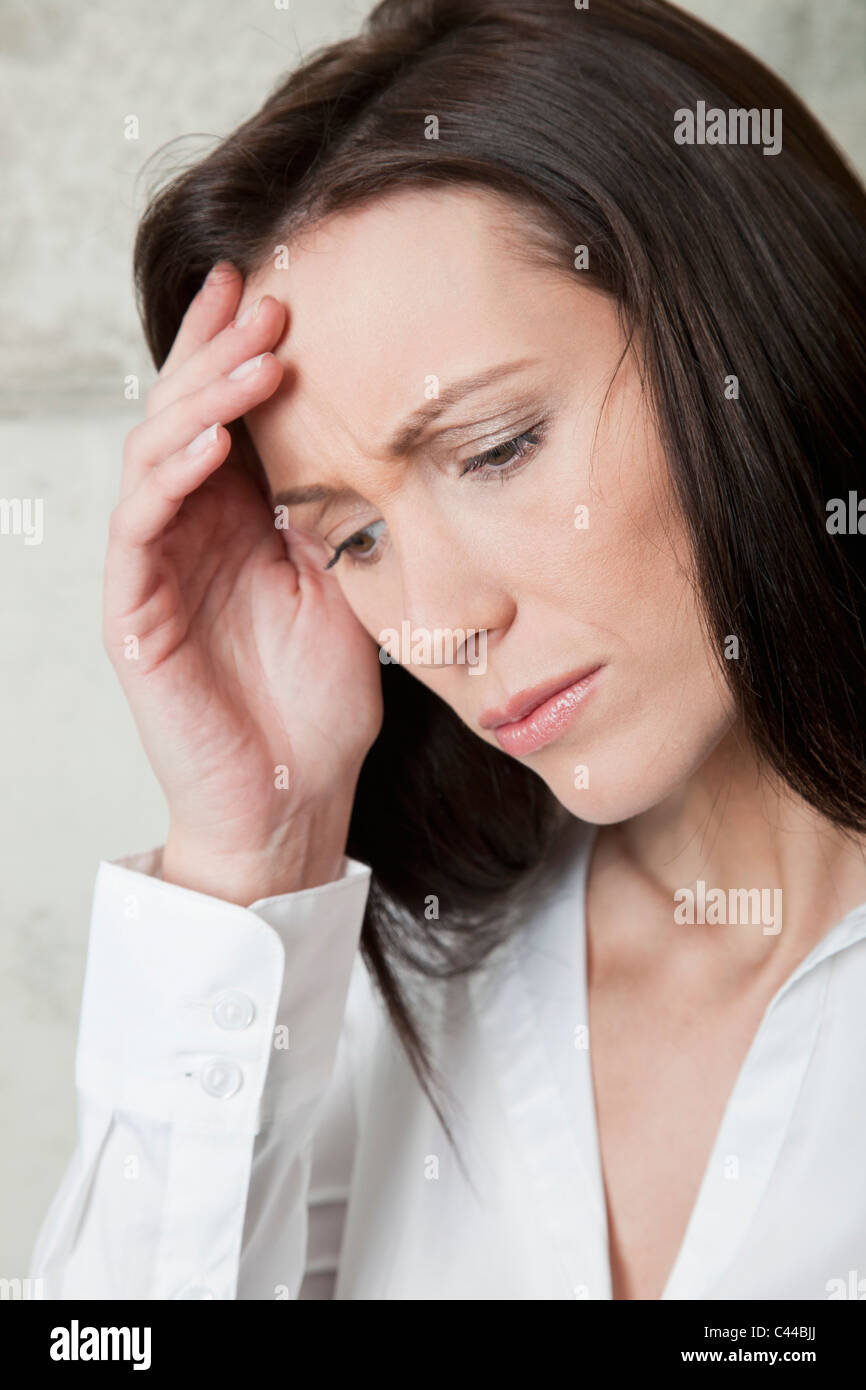 A stressed looking woman, close-up, portrait Stock Photo - Alamy