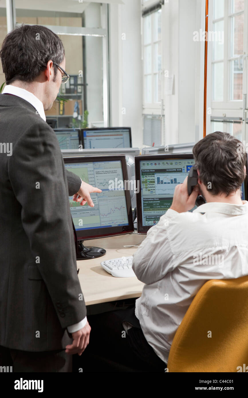 Teamwork on the stock charts Stock Photo - Alamy