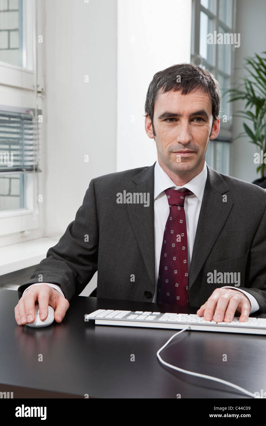 Businessman with mouse Stock Photo - Alamy