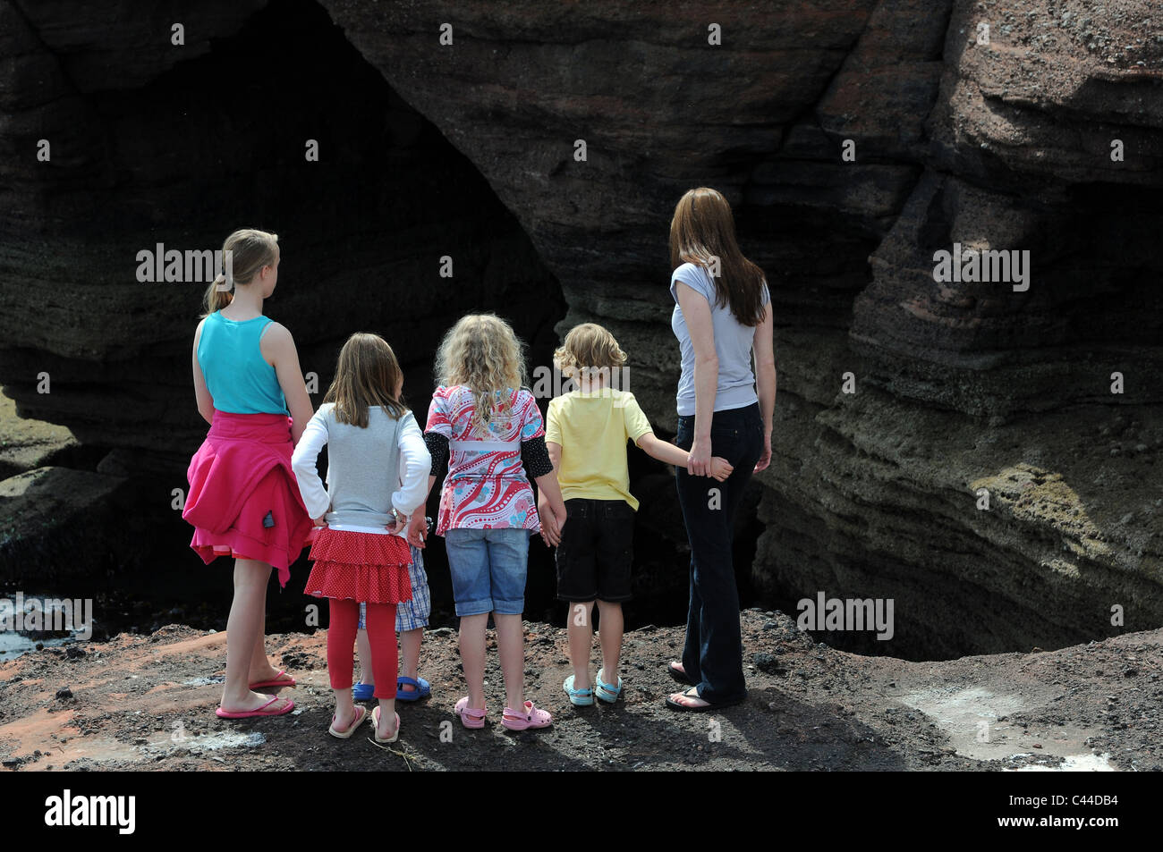 staycation,large family explore caves, rocks showing coastal erosion ...