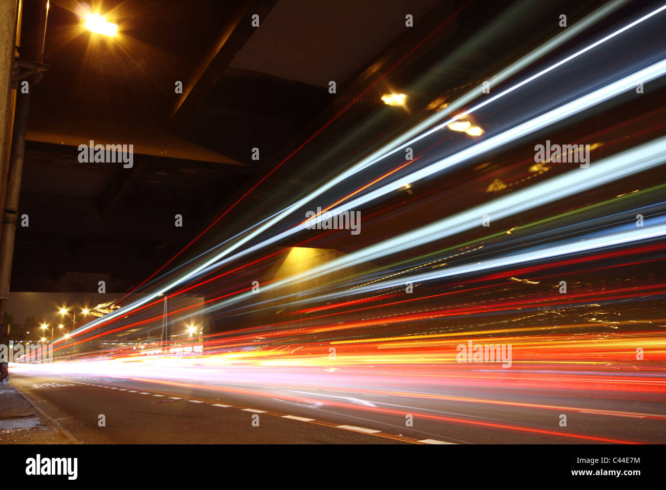 Fast moving cars at night Stock Photo - Alamy