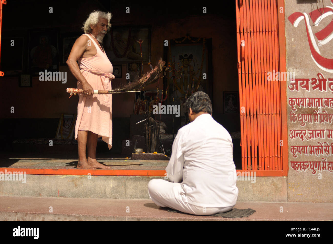 A Priest performing prayers in a Temple Stock Photo - Alamy