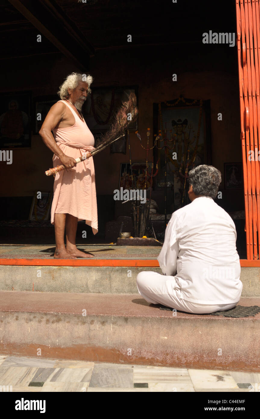 A Priest performing prayers in a Temple Stock Photo - Alamy