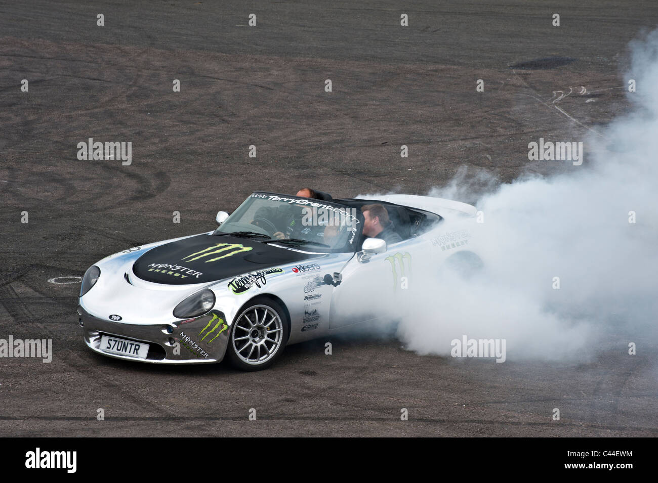 Terry Grant stunt driver performing at Santa Pod, smoking the tyres ...