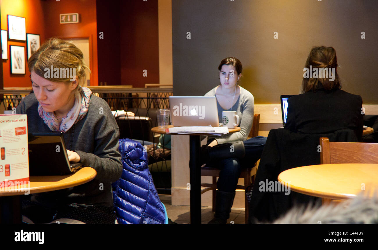 Wi-Fi users in Starbucks coffee shop Stock Photo - Alamy