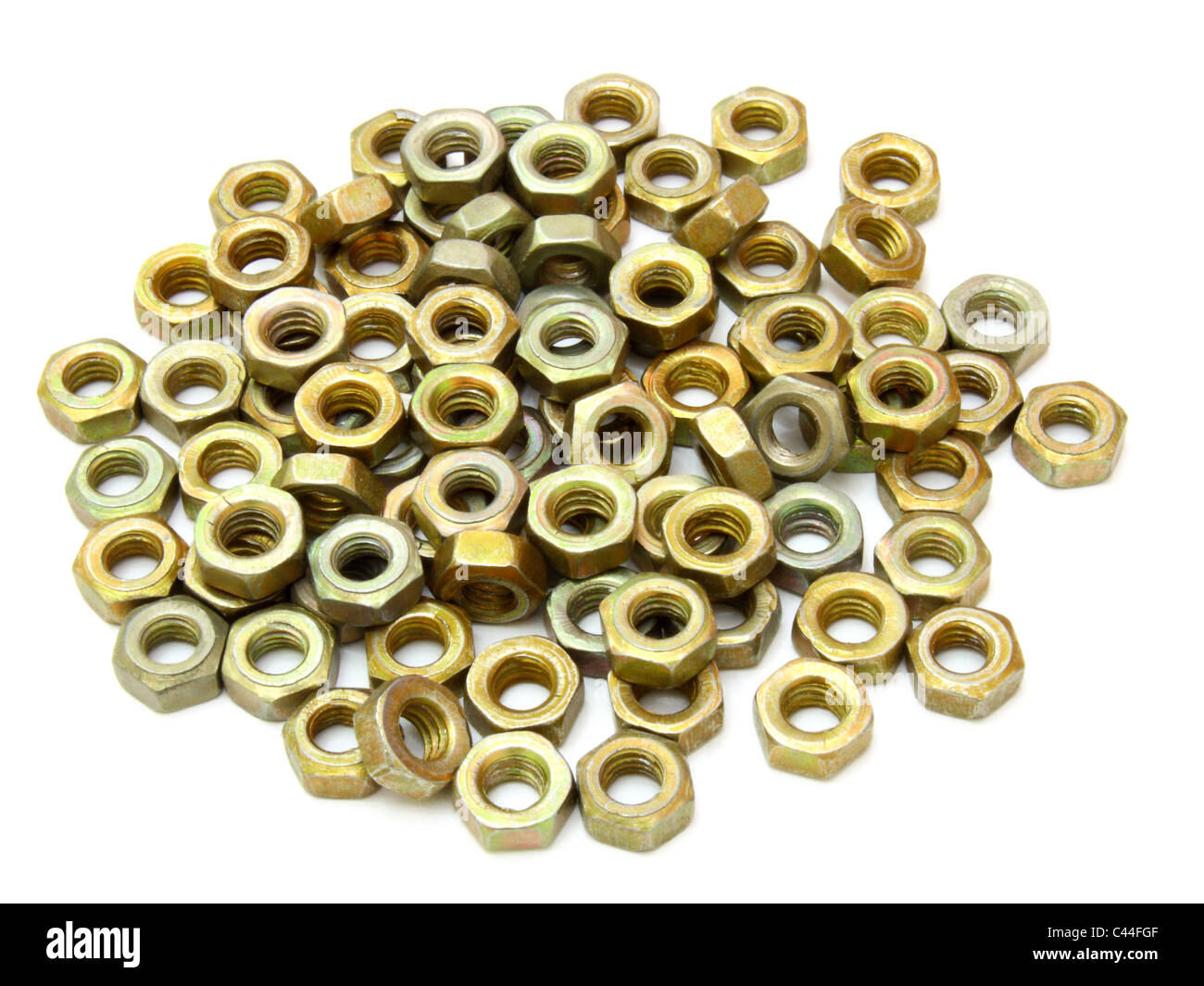 Small metal nuts on a white background a structure Stock Photo - Alamy
