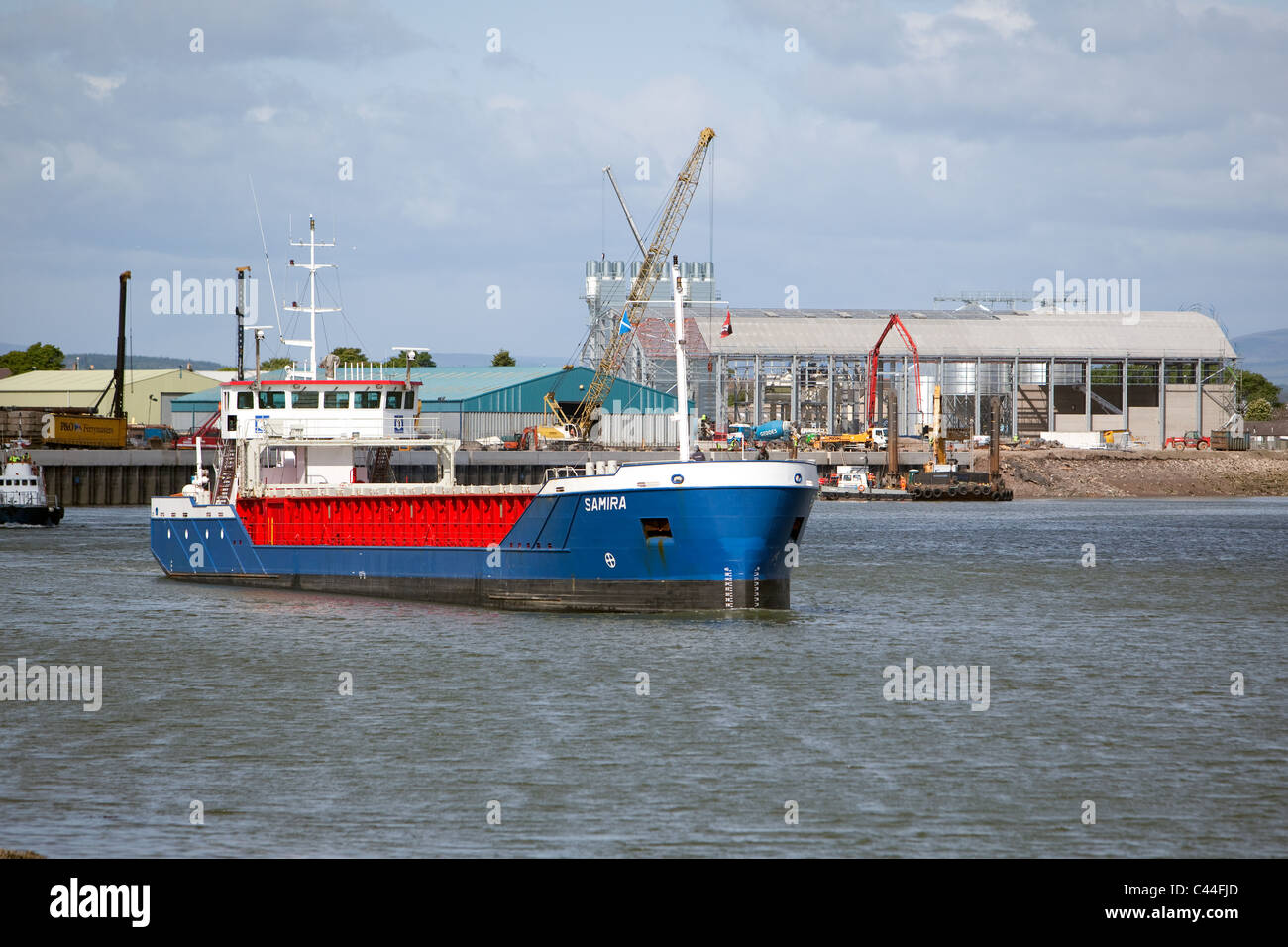 Small bulk cargo vessel sailing from Montrose Harbour out to north sea ...