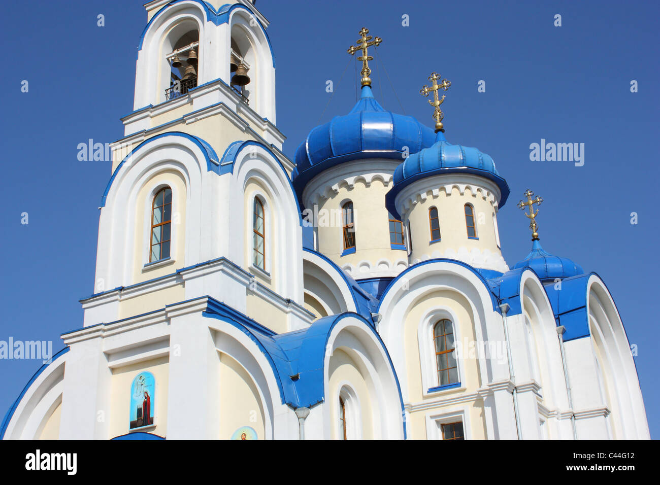 Christian church with dark blue domes of white color against the dark ...
