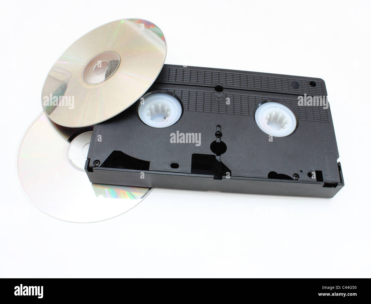 DVD disks and VHS video the cartridge on a white background in time and ...
