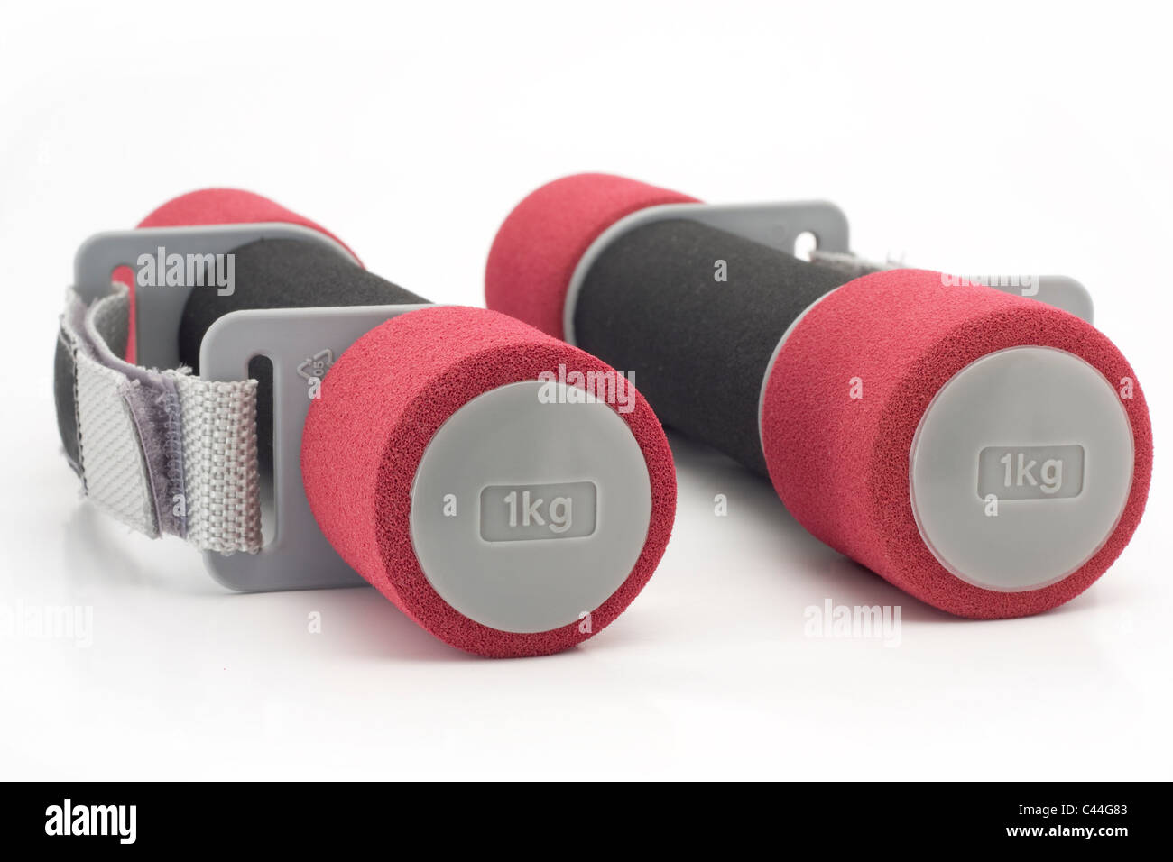 Small weights on white background Stock Photo - Alamy