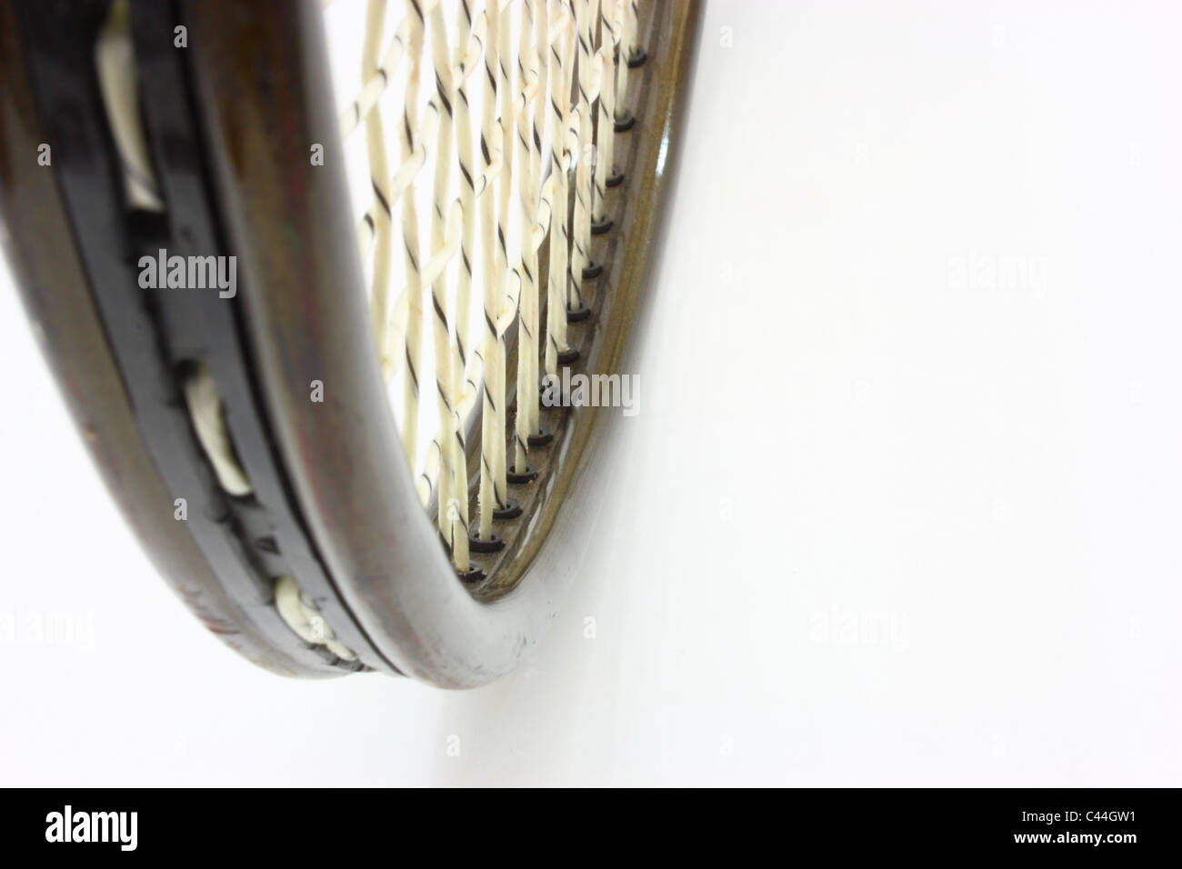 Tennis racket of brown color on a white background Stock Photo - Alamy
