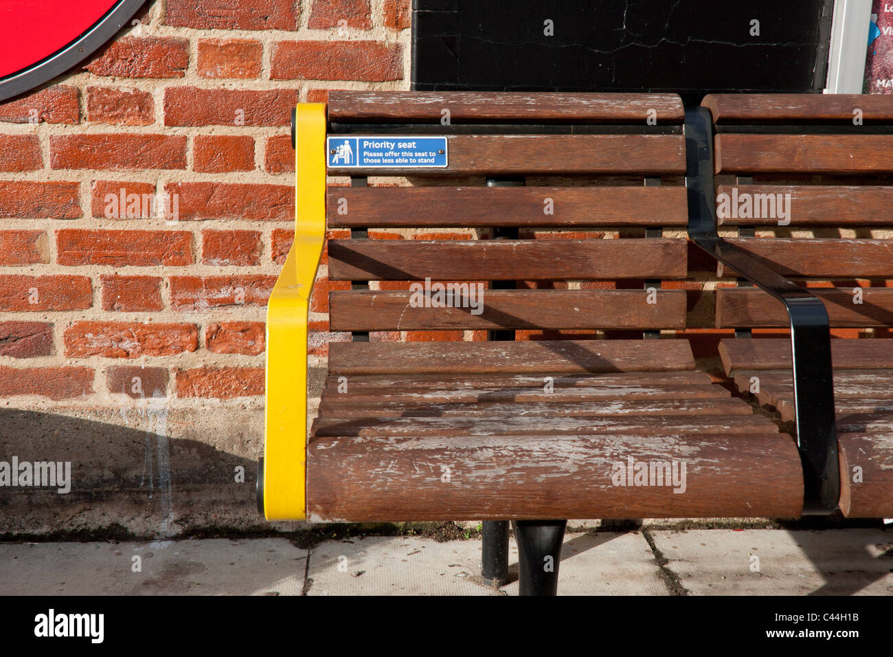 Priority seat on bench at Epping Underground station at the East end of ...