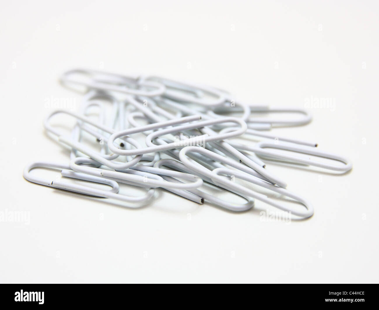Color paper clips to background. Isolated on white background Stock ...