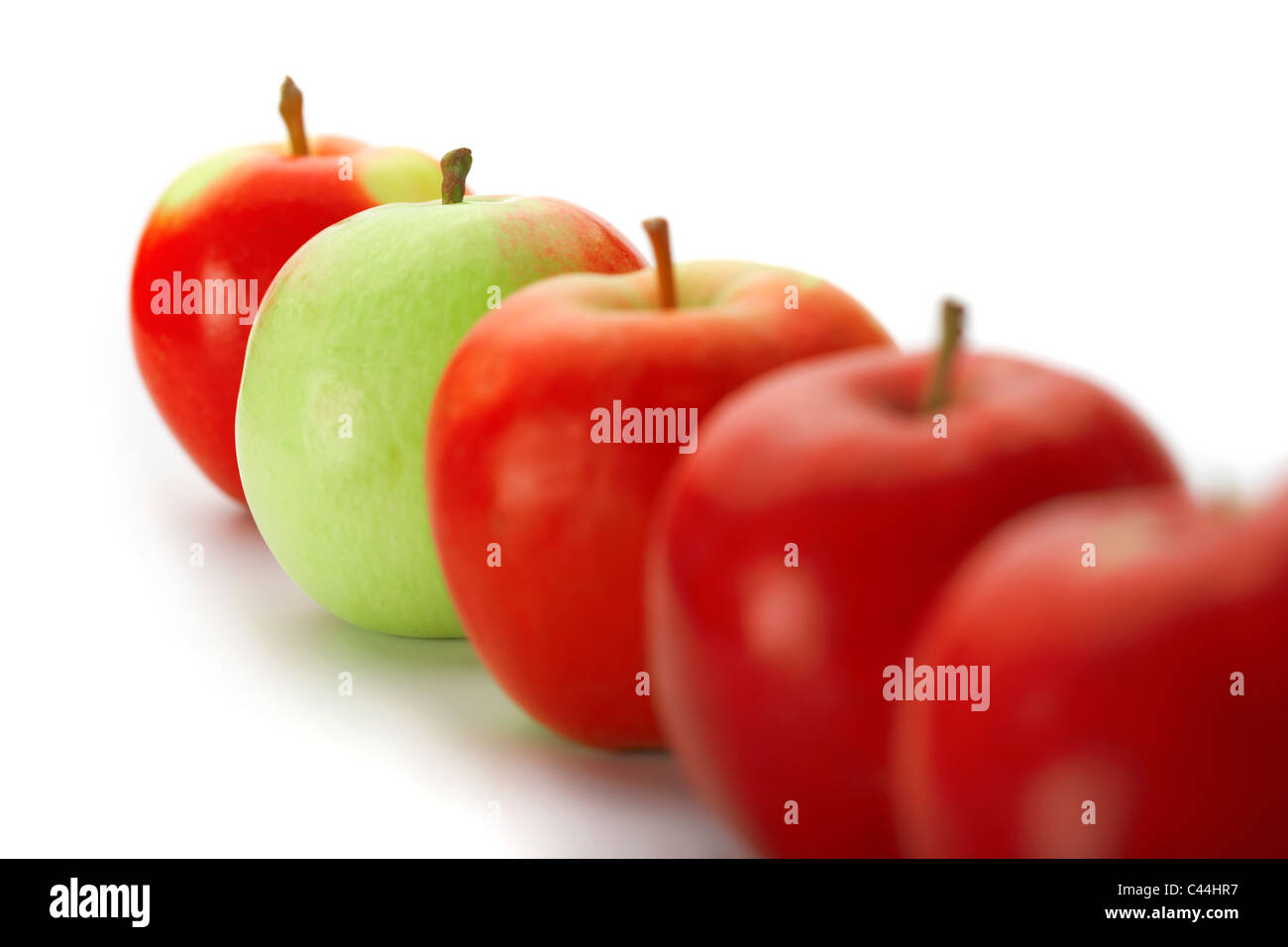 Group of red apples with one green one Stock Photo - Alamy