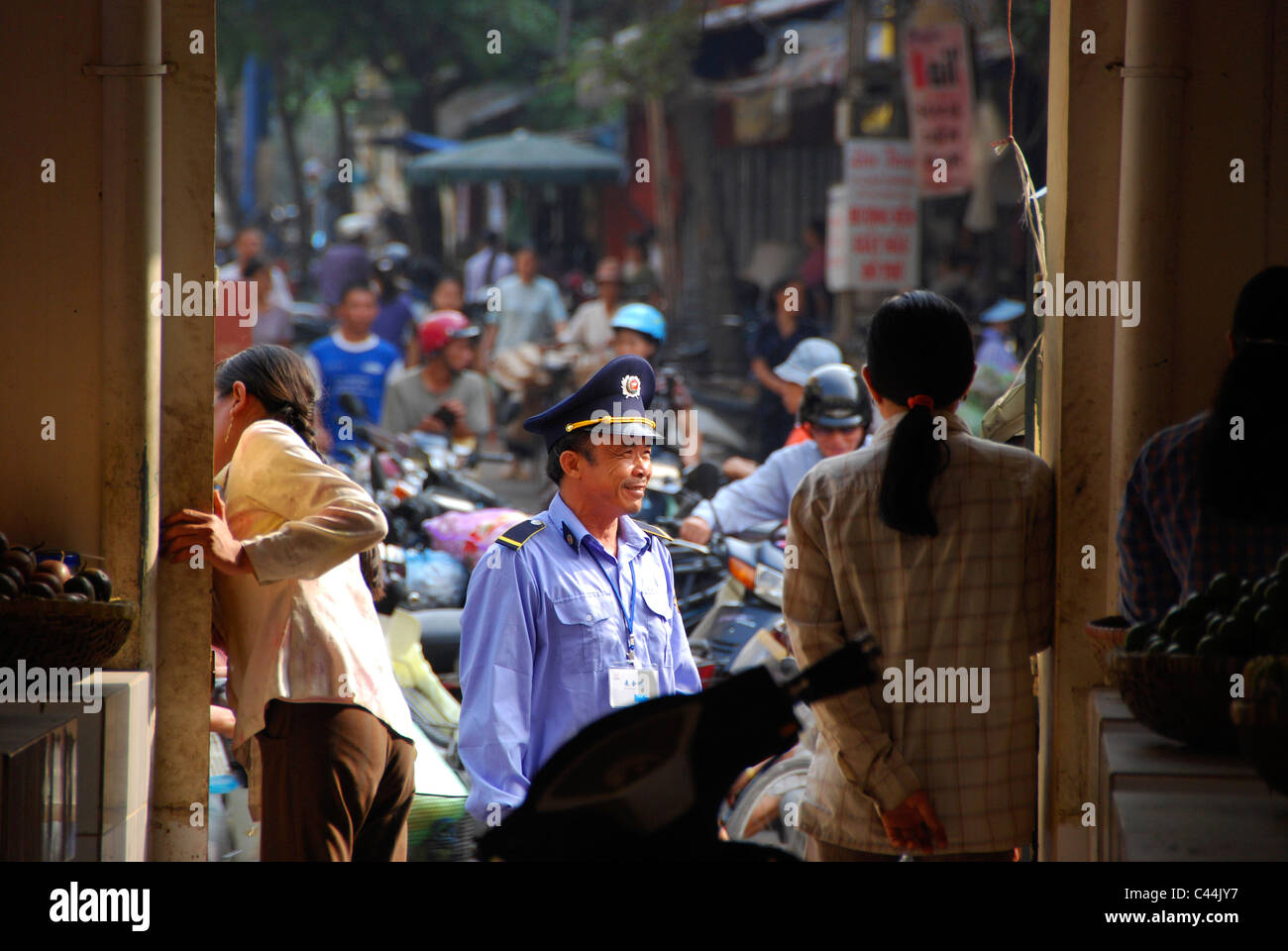 Market inspector from a doorway, Hanoi, Vietnam Stock Photo - Alamy