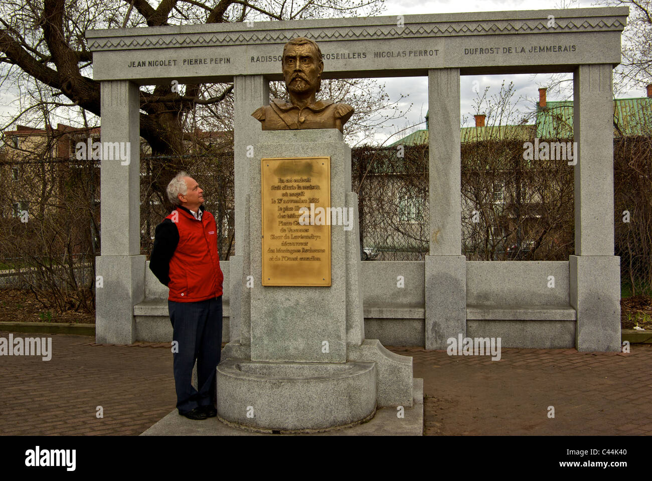 Tour guide standing in small square dedicated to French Canadian ...
