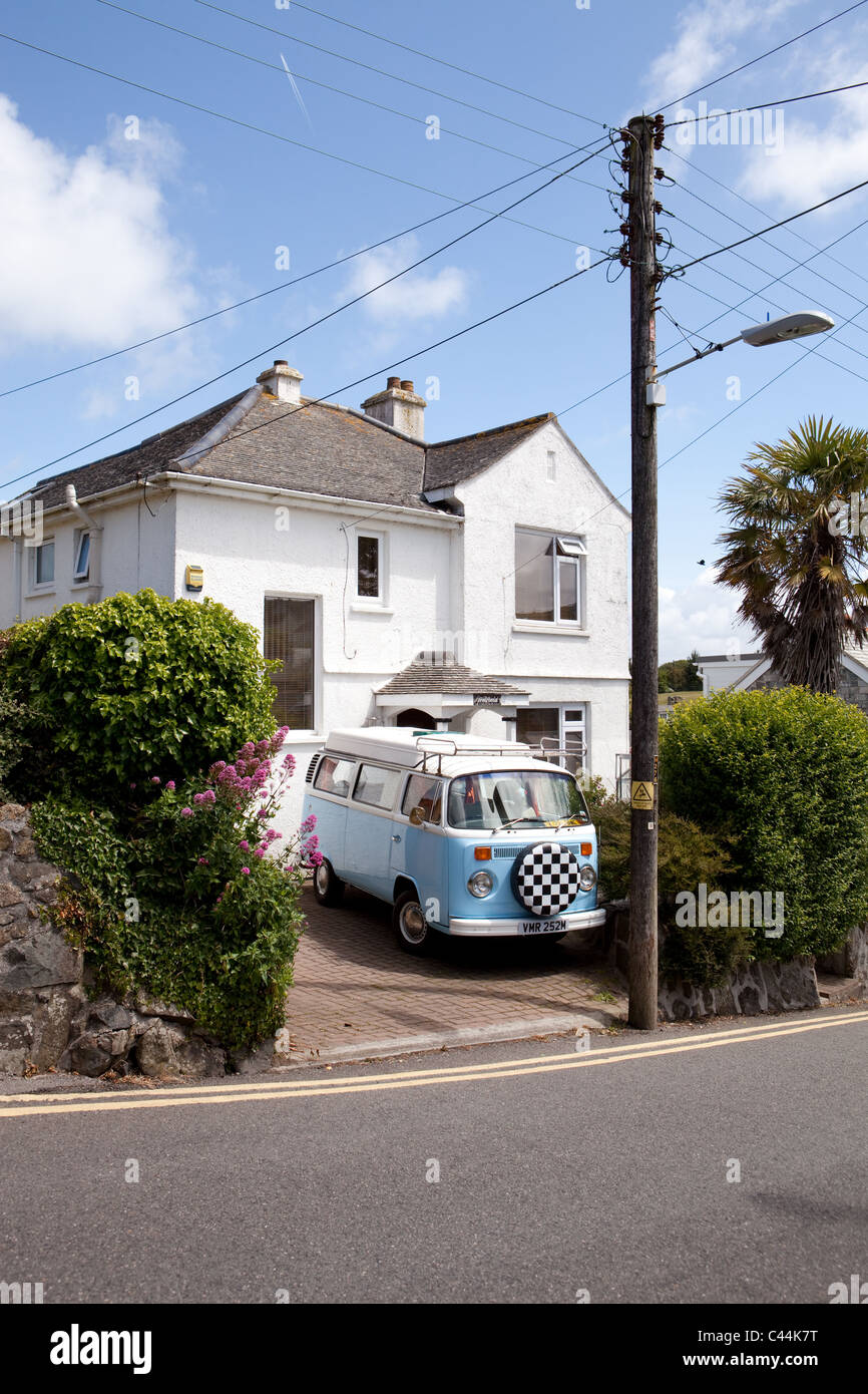 A classic Volkswagen camper van parked outside a house in St Ives ...