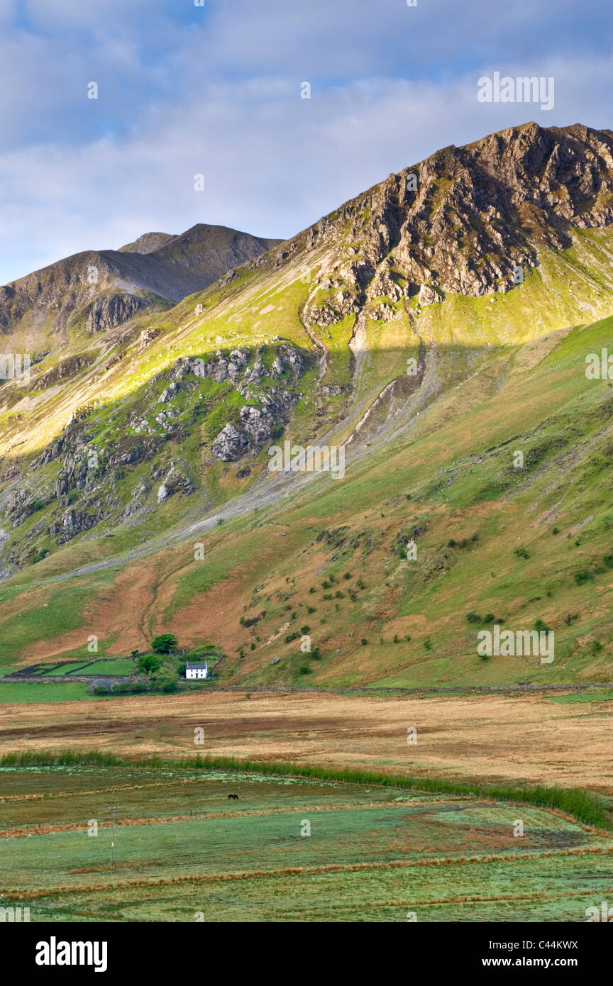 Whitewashed Welsh Cottage below the peak of Foel Goch, Nant Ffrancon ...