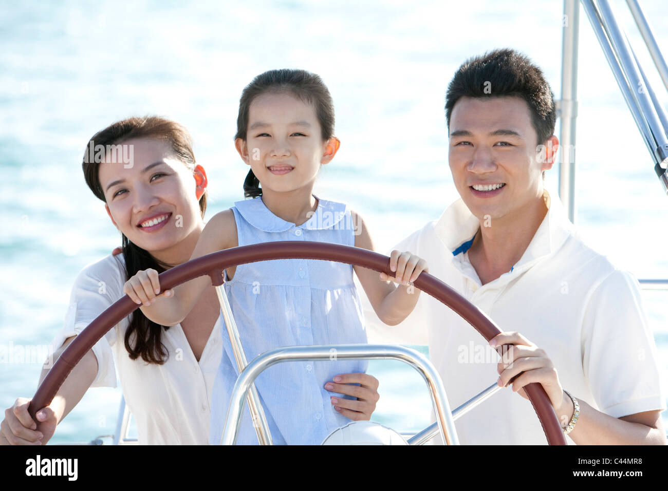 Happy Family Sailing Stock Photo - Alamy