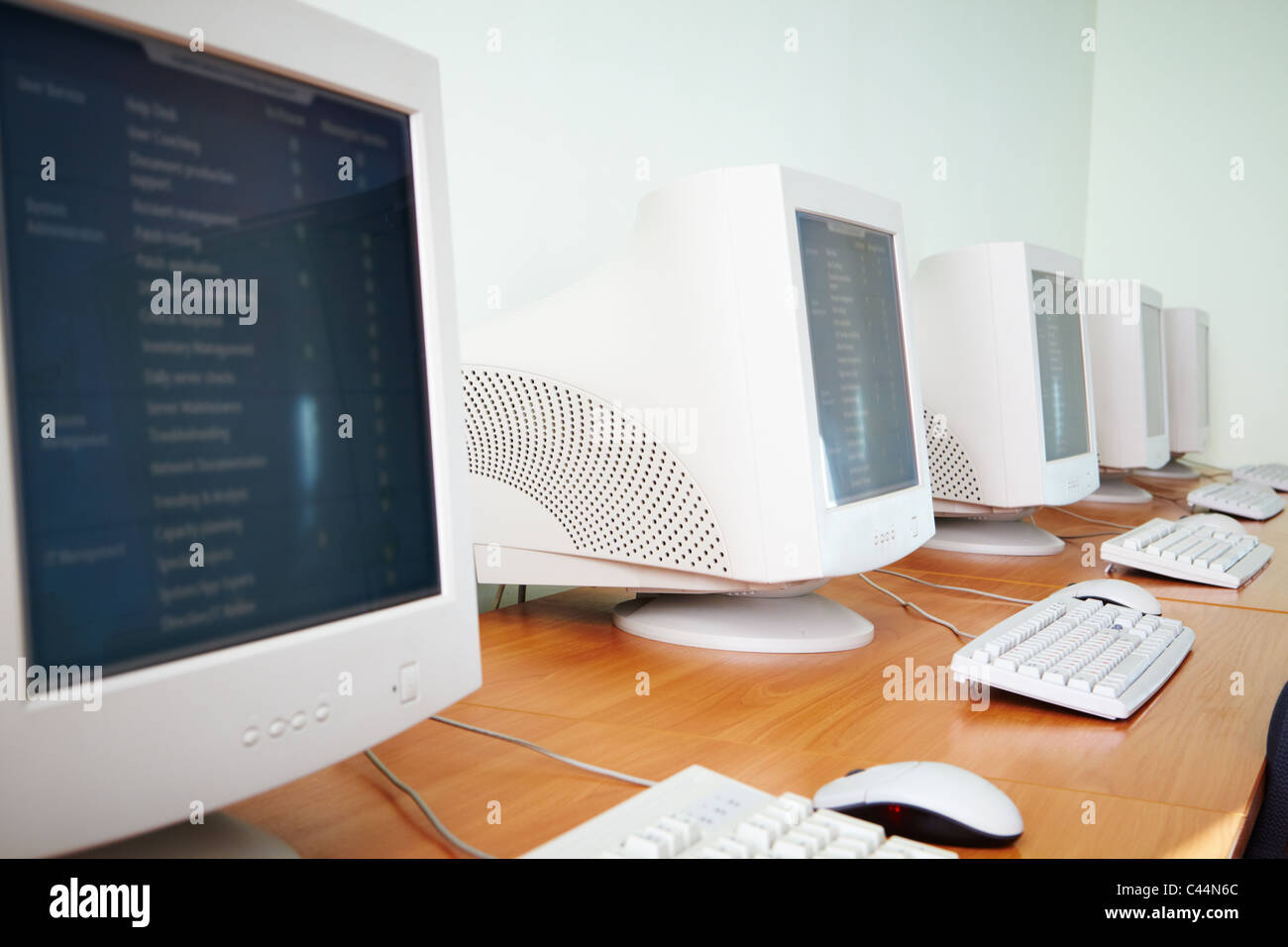 Photo of row of computers in classroom of college or other educational ...